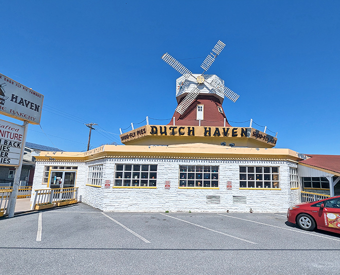 The iconic windmill-topped Dutch Haven stands proudly against a blue Pennsylvania sky, beckoning pie lovers from miles around.