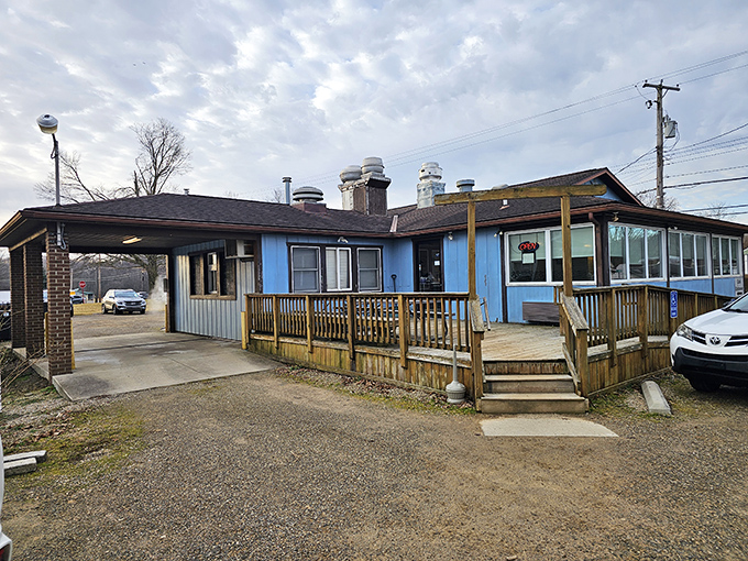 The humble blue exterior of Wedgewing might not scream "culinary destination," but that wooden deck has welcomed more food pilgrims than most fancy bistros ever will.