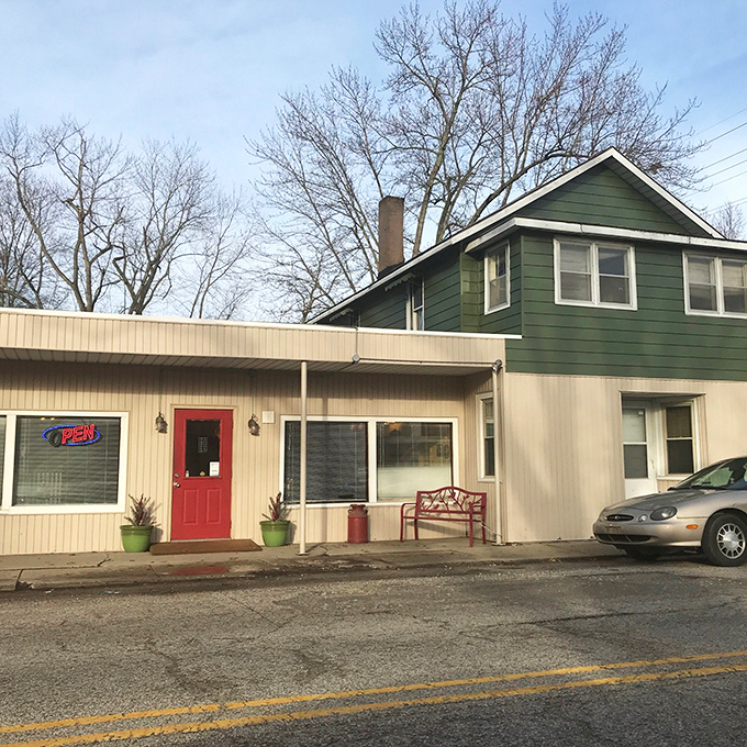Morning light bathes Bev's modest storefront, where that neon "OPEN" sign might as well say "SALVATION" to anyone craving honest-to-goodness comfort food.
