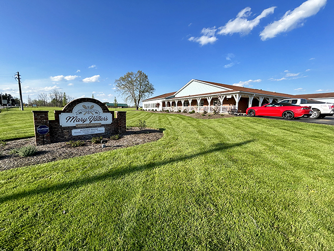 A perfectly manicured lawn leads to culinary paradise. The sign might as well read "Abandon Diets, All Ye Who Enter Here."