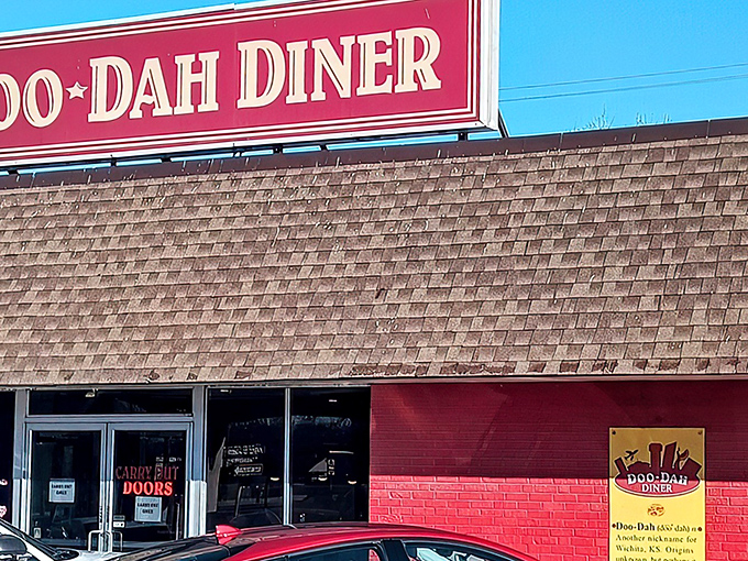 The iconic red sign of Doo-Dah Diner stands out against the Wichita sky like a beacon for breakfast pilgrims seeking comfort food salvation.
