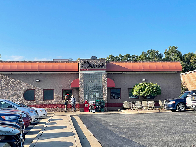 Oscar's welcoming exterior beckons hungry travelers with its distinctive stone facade and copper-colored awnings&mdash;a Jefferson City landmark promising comfort food paradise within.