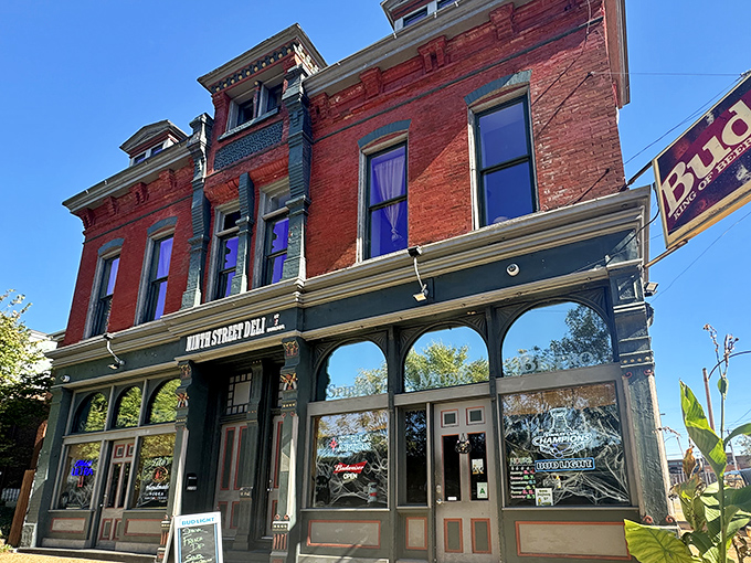 The historic brick façade of Ninth Street Deli @ Howard's promises culinary treasures within. St. Louis sandwich seekers, your quest ends here.