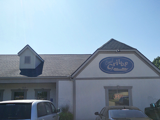 The welcoming facade of Canal Grille stands ready to rescue hungry travelers with its homestyle charm and corrugated metal porch railings.
