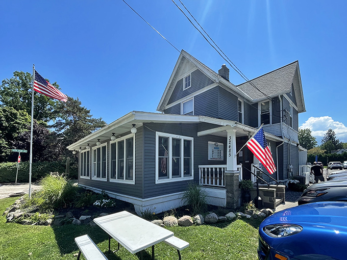 Bathed in daylight, this converted house-turned-restaurant stands proudly with American flags fluttering, like a Norman Rockwell painting come to delicious life.