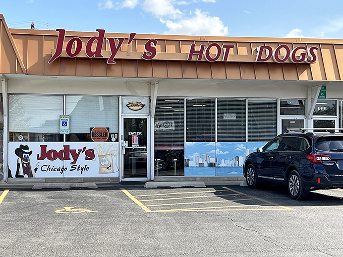 The unassuming storefront of Jody's Hot Dogs in Joliet&mdash;where culinary magic happens behind that Chicago skyline window decal.