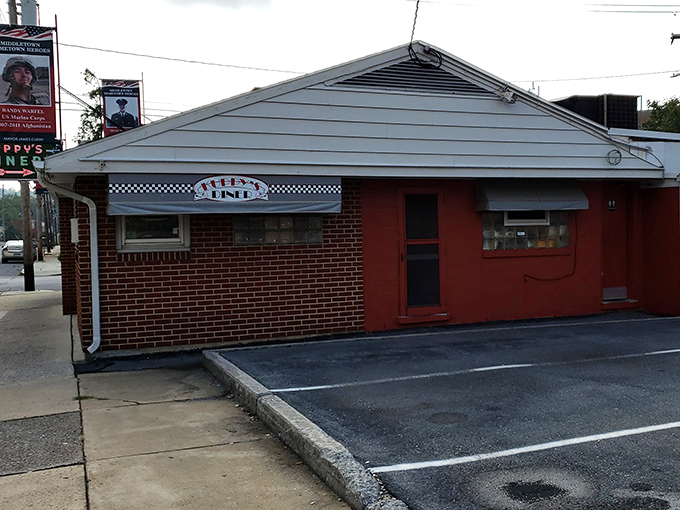 The humble brick exterior of Kuppy's Diner stands like a time capsule in Middletown, promising comfort food that predates food influencers and avocado toast.