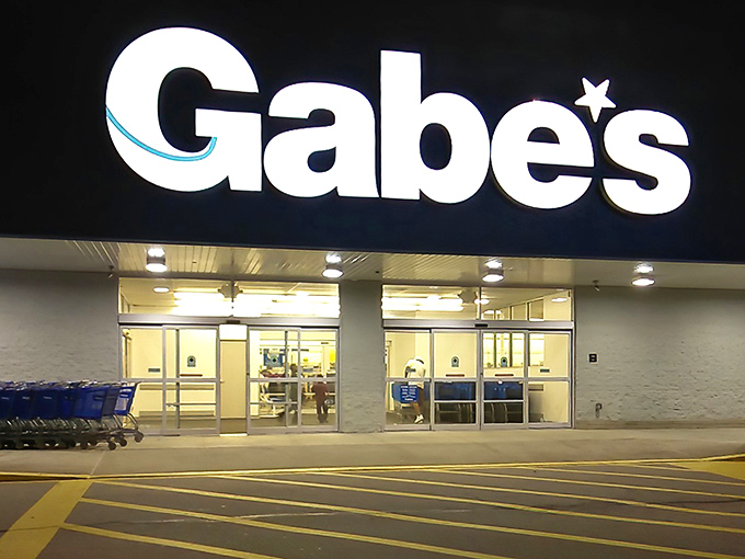 The iconic blue Gabe's sign glows like a beacon for bargain hunters, promising treasure troves of discounts within those unassuming walls.
