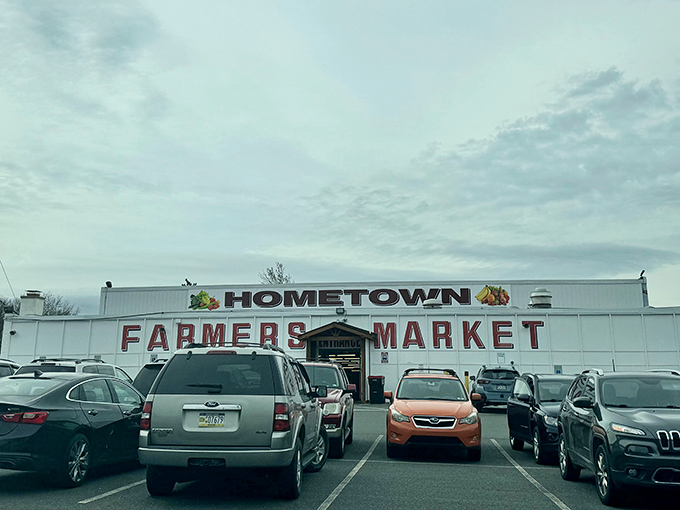 The white facade of Hometown Farmers Market stands like a beacon of bargains. Wednesday pilgrims flock here with empty trunks and high hopes.