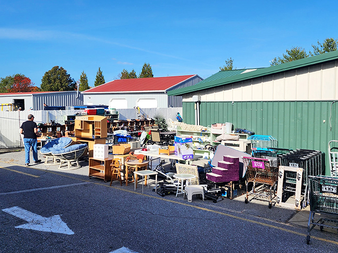 The outdoor treasure hunt begins! New Life's parking lot transforms into an open-air bazaar where yesterday's furniture awaits tomorrow's homes.