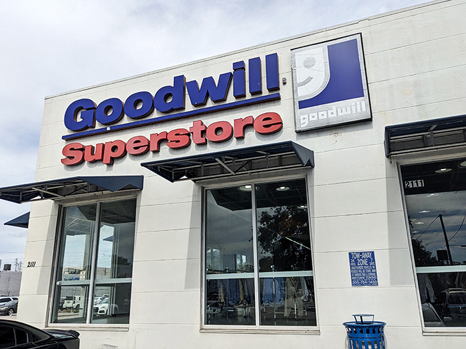 The blue and red Goodwill Superstore sign beckons like a lighthouse for bargain hunters. Florida's thrift paradise awaits behind these unassuming walls.