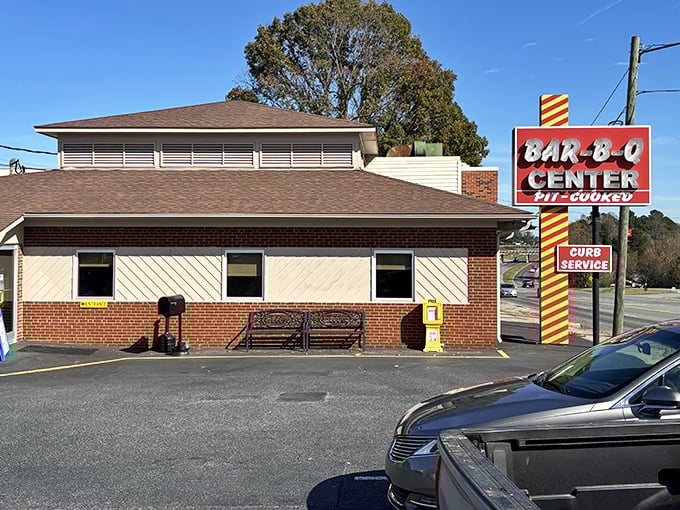 The modest brick exterior of The Barbecue Center stands like a beacon for hungry travelers, promising smoky delights within those unassuming walls.
