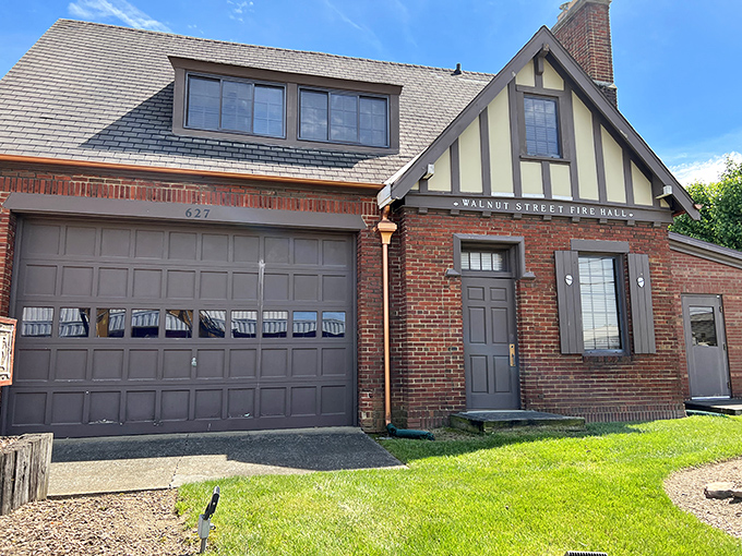 The brick exterior of The Firehouse beckons like a siren call to BBQ lovers, complete with that iconic red door promising smoky treasures within.