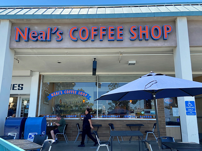 The iconic red lettering of Neal's Coffee Shop beckons like a lighthouse for the breakfast-starved masses of San Mateo.