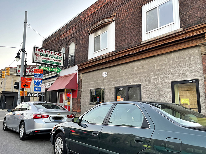 Detroit's architectural history frames Duly's Place perfectly&mdash;brick buildings and that unmistakable red awning signaling comfort food ahead.