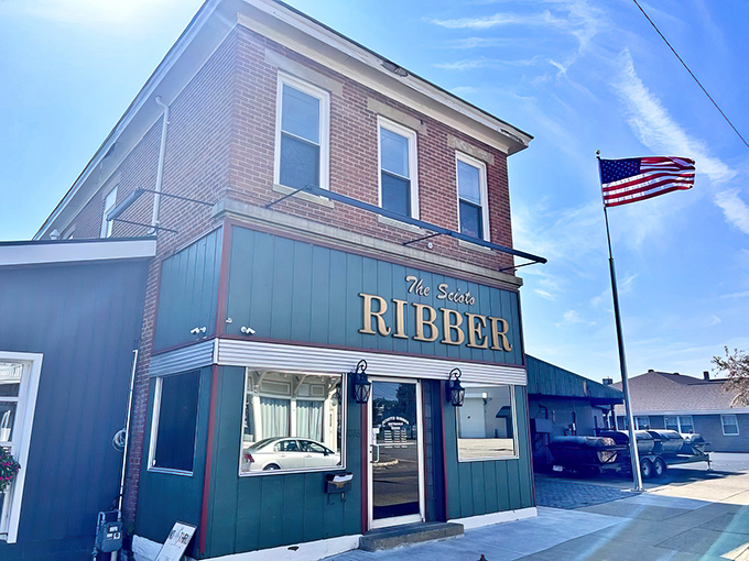 The unassuming blue facade of Scioto Ribber stands proudly in Portsmouth, where the American flag waves as if to say, "Trust me, the good stuff's inside."