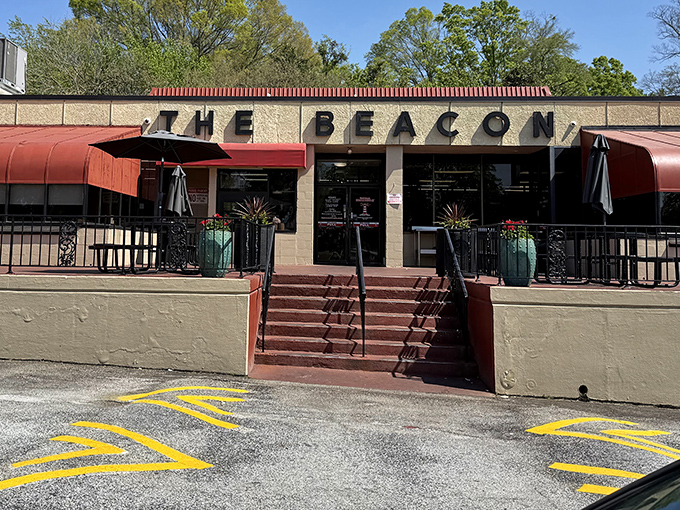 The iconic facade of The Beacon stands proud in Spartanburg, its red awnings beckoning hungry travelers like a culinary lighthouse on the South Carolina shore.