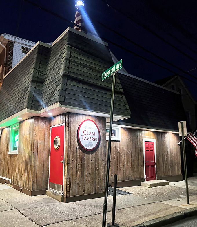 The wooden-shingled exterior with its iconic red doors stands like a maritime beacon on Edgemont Avenue, promising seafood treasures within.