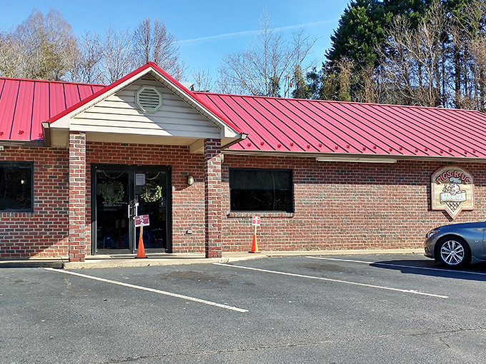 Sometimes the most memorable meals happen in the most unassuming places. This brick building with its bright red roof houses barbecue magic worth traveling for.