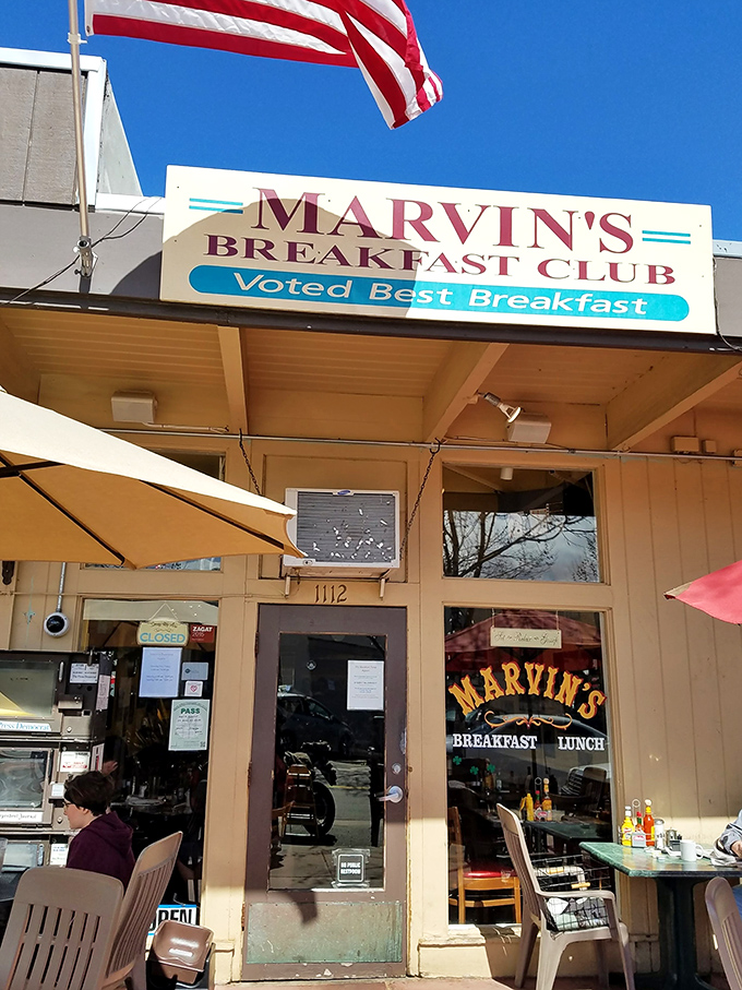 The American flag waves proudly above Marvin's Breakfast Club, a humble storefront that's earned its "Voted Best Breakfast" badge through years of morning meal mastery.
