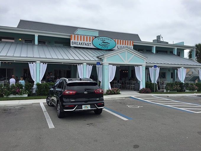 The turquoise facade of Doreen's Cup of Joe stands like a beacon of breakfast hope on Marco Island, promising morning salvation one waffle at a time.