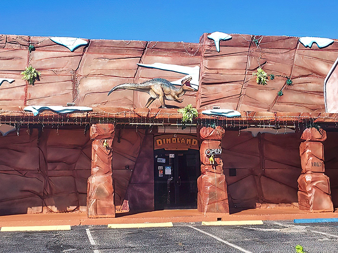 The exterior of DinoLand Cafe looks like a movie set that escaped from Hollywood, complete with a dinosaur sentinel guarding the entrance.