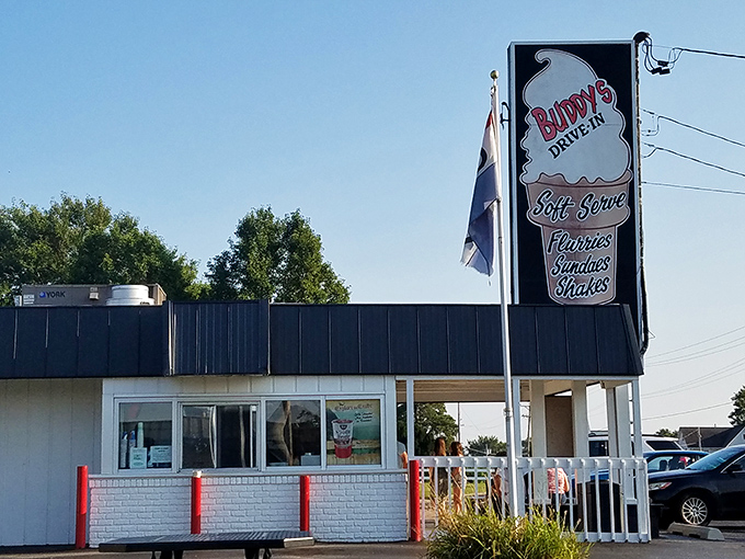 The iconic Buddy's Drive-In sign stands tall against the Illinois sky, promising frozen delights that have drawn generations of sweet-toothed pilgrims to Beecher.