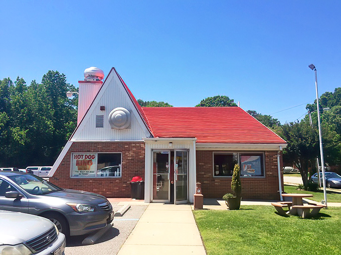 This little hot dog haven has been turning first-time visitors into regulars for generations. The red roof is like a culinary lighthouse.