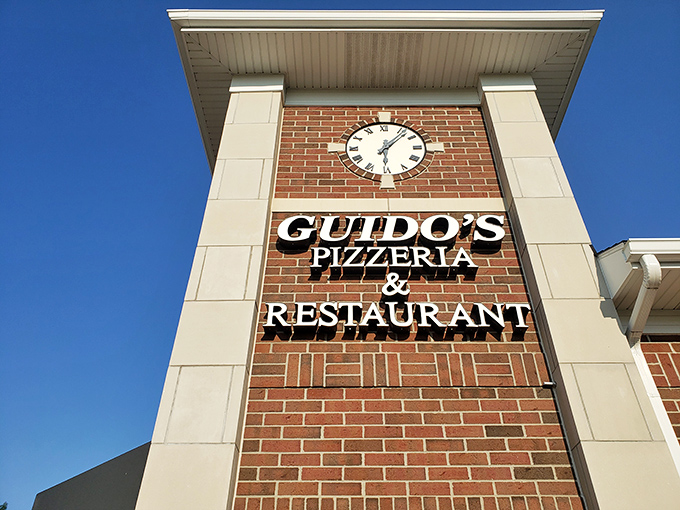 Guido's brick fa&ccedil;ade with its distinctive clock tower stands like a culinary lighthouse, beckoning hungry travelers with the promise of Italian comfort.