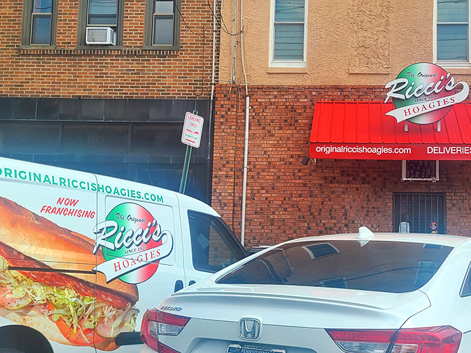 The unassuming brick exterior of Ricci's Hoagies stands as South Philly's sandwich sanctuary, where the neon sign promises&mdash;and delivers&mdash;hoagie perfection.