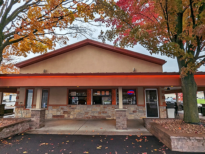 The unassuming exterior of Jaenicke's Drive-In stands like a culinary lighthouse amid autumn foliage, promising simple pleasures done extraordinarily well.