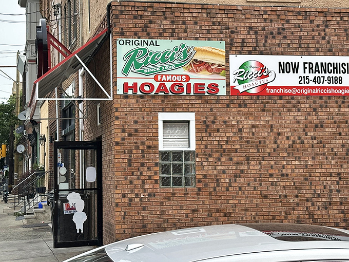 The unassuming brick exterior of Ricci's Hoagies stands as South Philly's sandwich sanctuary, where the neon sign promises&mdash;and delivers&mdash;hoagie perfection.