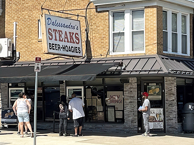 The iconic Dalessandro's sign beckons hungry pilgrims like a neon North Star. Philadelphia's sandwich seekers know this Roxborough landmark means serious business.