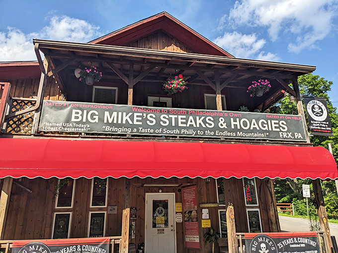 The rustic wooden facade with its bold red awning stands like a South Philly embassy in the Pennsylvania mountains. "Calm down, you're in Forksville" indeed.