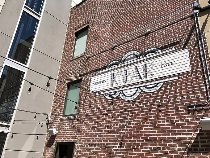 The brick facade of K'Far Cafe stands as a modern beacon of Israeli cuisine in Philadelphia's Rittenhouse Square, where culinary magic awaits behind those doors.