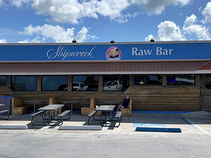 The weathered wooden exterior and bright blue corrugated metal isn't trying to impress you&mdash;it's saving all that energy for what's on your plate.