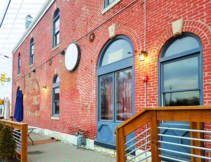 Another angle of Geraldine's distinctive exterior, where the weathered brick and blue accents create an inviting entrance to this Fountain Square gem.