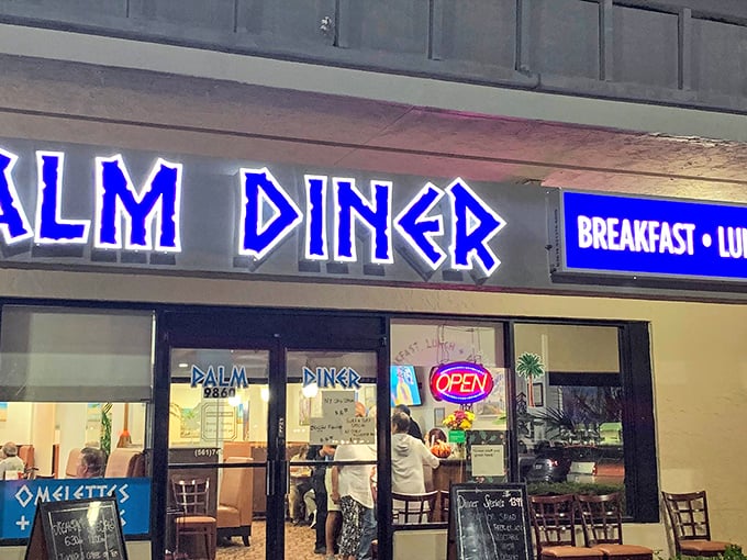 The blue neon glow of Palm Diner beckons hungry travelers like a lighthouse for the famished. No fancy frills, just the promise of honest-to-goodness food.