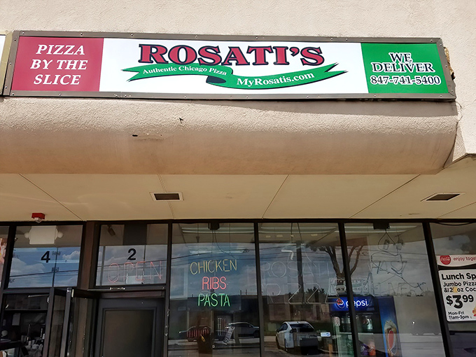The iconic red, white, and green Rosati's sign beckons hungry travelers like a pizza lighthouse in the suburban sea of Elgin.