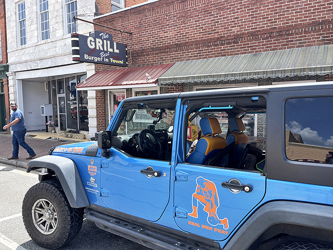 The brick facade and vintage sign of The Grill in Hawkinsville promises what every great roadside find should: the "Best Burger in Town" isn't just a claim&mdash;it's a mission statement.