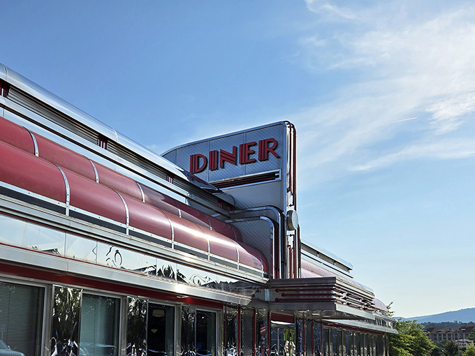 The gleaming chrome exterior of Mel's Diner catches the Tennessee sunlight like a time machine ready to transport you back to simpler days.