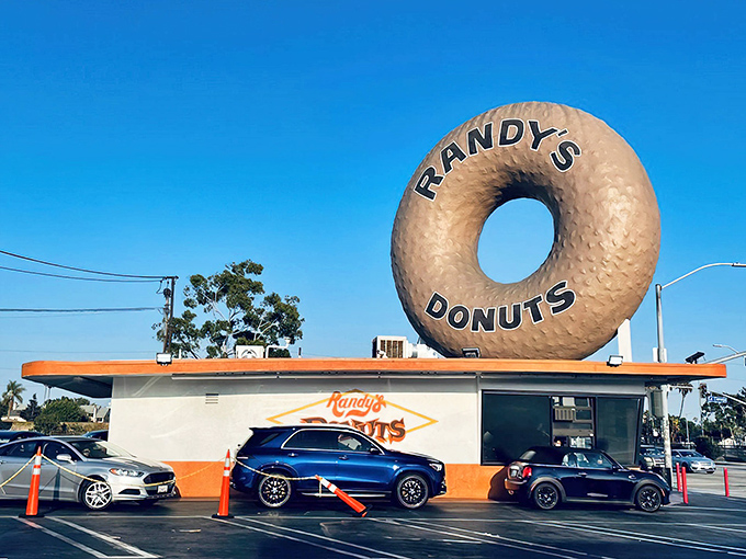 The most famous donut in America stands sentinel over Inglewood, beckoning sugar-seekers from miles away like a carb-loaded lighthouse.