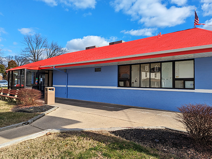 The classic blue-and-red exterior of Wilmington Diner stands like a beacon of breakfast hope on Marsh Road, promising comfort food salvation inside.