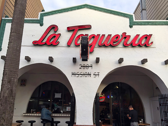 The iconic white facade with that red script sign is like a beacon of hope for burrito lovers everywhere. Mission District's culinary North Star.