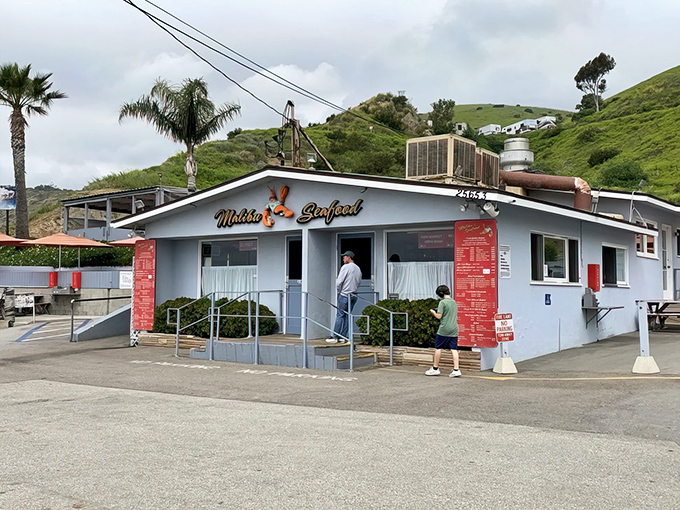 The unassuming blue building with red trim that's launched a thousand seafood pilgrimages. Proof that culinary treasures don't always wear fancy packaging.