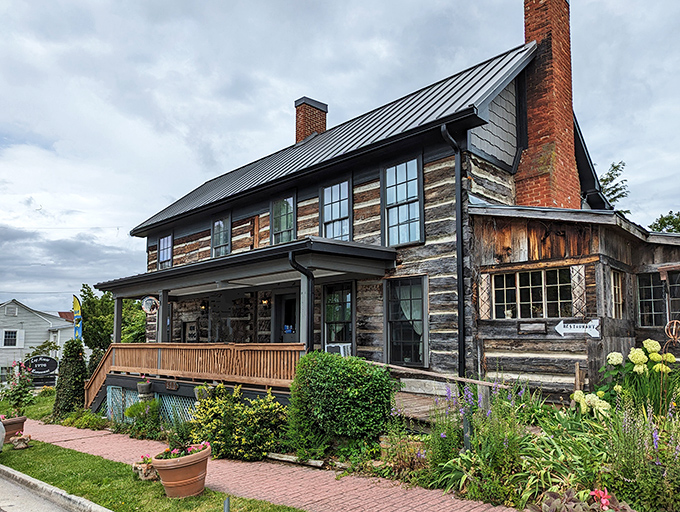 The historic Log House Restaurant stands proudly in Wytheville, its weathered timbers and twin brick chimneys whispering tales of Virginia's past.
