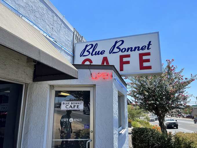 That iconic red sign beckons like a lighthouse for hungry travelers. Pie Happy Hour? Now that's civilization at its finest!