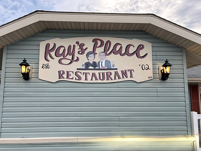 The blue-sided building with its welcoming sign feels like an invitation to dinner at a friend's house rather than a commercial establishment.