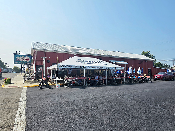 The red barn exterior of Whistle Stop isn't just charming&mdash;it's a beacon for hungry travelers. That outdoor seating area practically whispers "stay awhile."