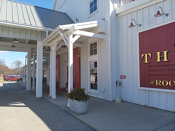 The white barn exterior with striking red accents isn't just farm-chic architecture&mdash;it's nature's way of saying "good food lives here."